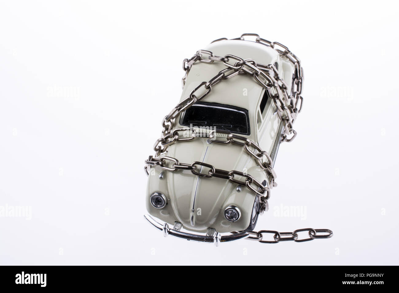 Chained white car on white background Stock Photo - Alamy