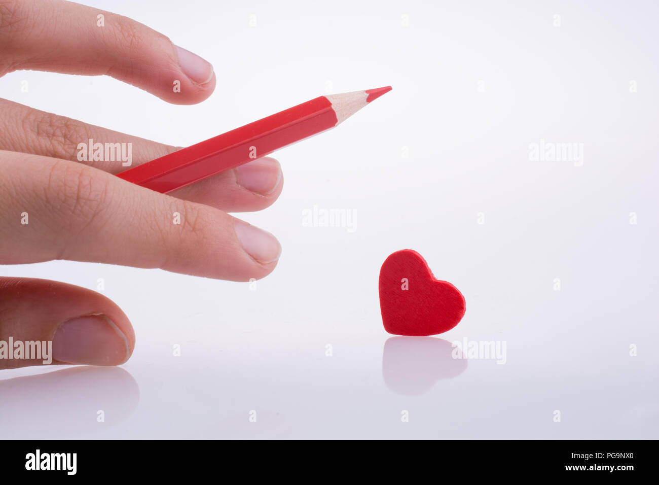 How to draw a hand holding heart hi-res stock photography and images ...