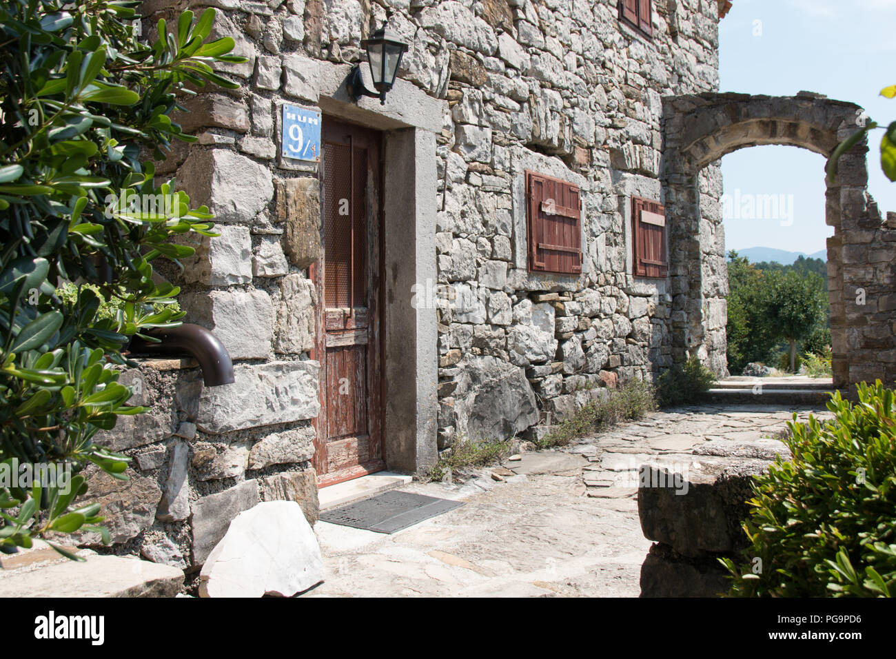 Hum, Croatia - July 29, 2018: View of an old stone house in the town of ...