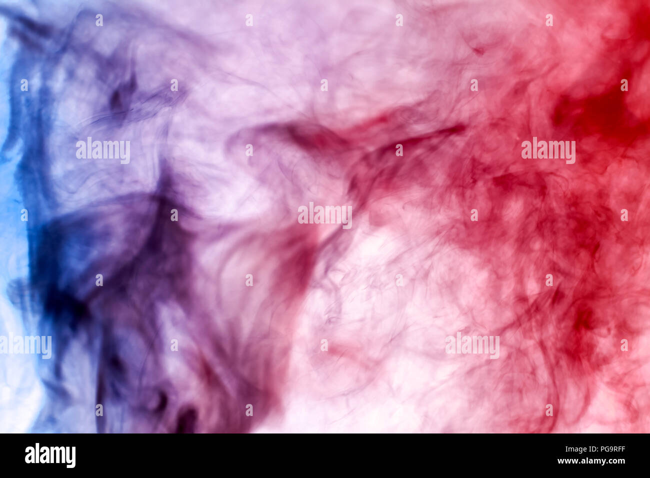 Cloud of red and blue smoke on a black isolated background. Background ...