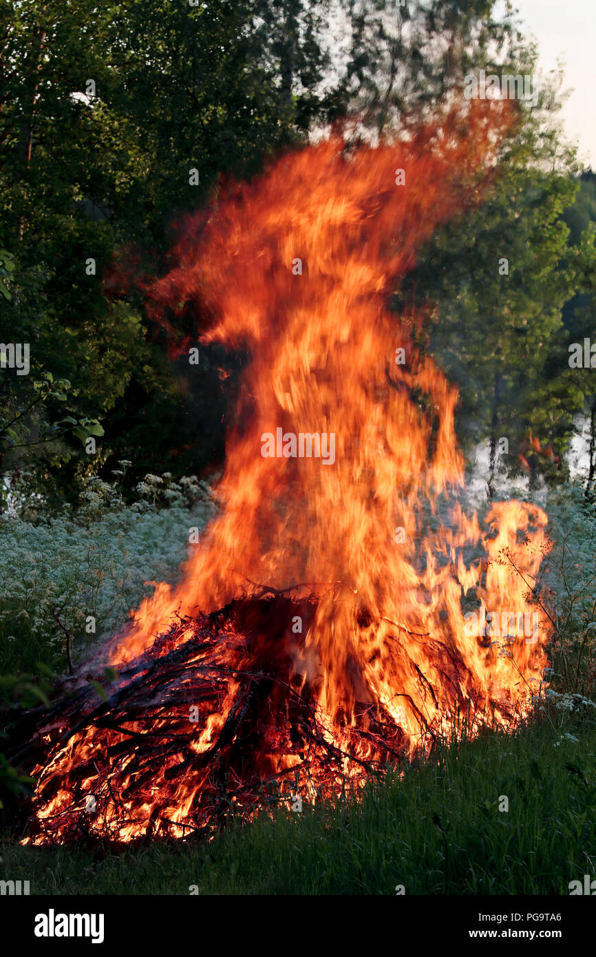 Bonfire burning in midsummer eve Stock Photo - Alamy