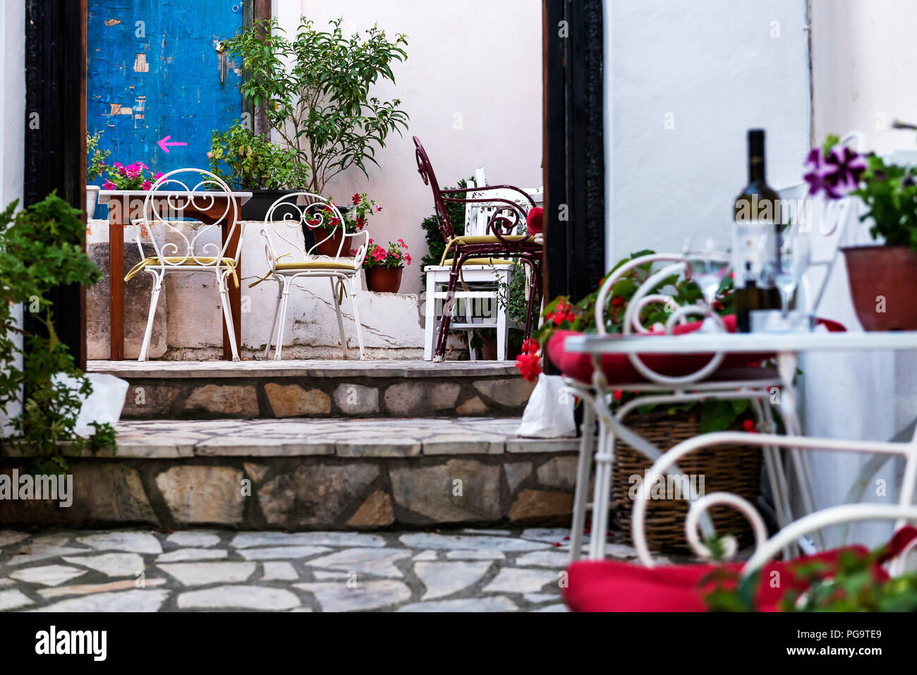 Tables of restaurants at Colorful streets of Parga, Greece Stock Photo ...