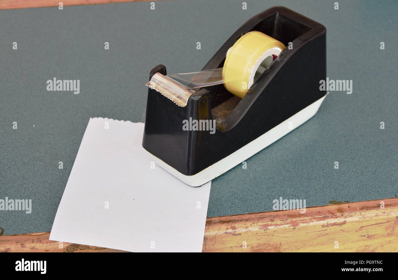 paper note and tape dispenser on counter cashier in shop Stock Photo ...
