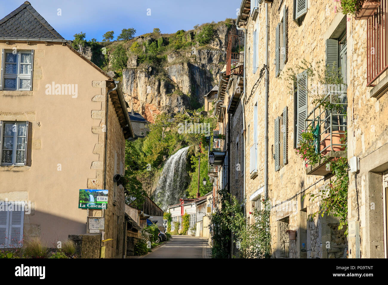 France, Aveyron, Salles la Source, waterfall in the center of the ...