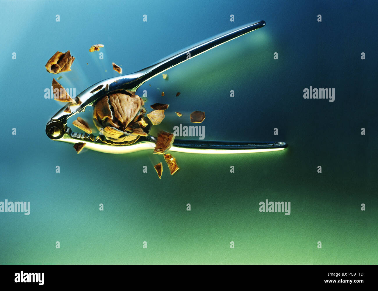 A nutcracker cracking a nut with flying shells Stock Photo - Alamy