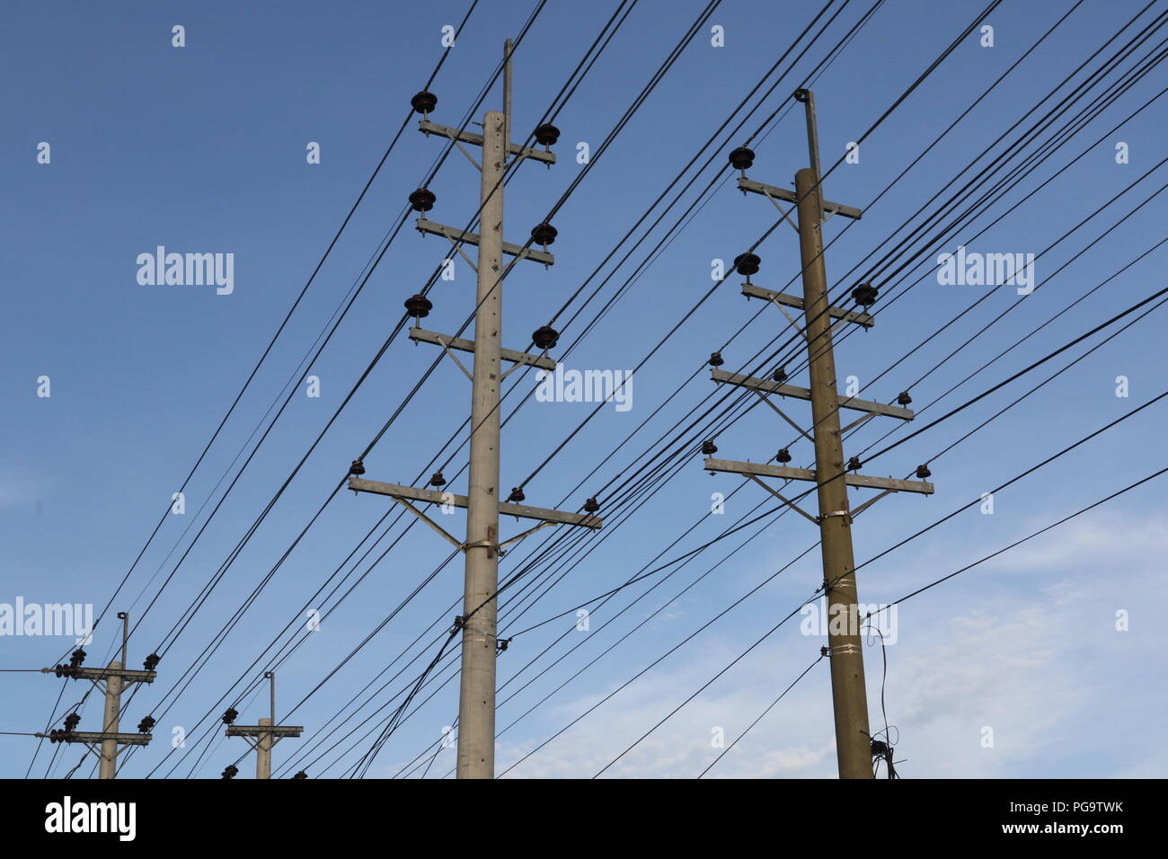 Electrical power lines hang from transmission pylons in Dhaka Stock ...