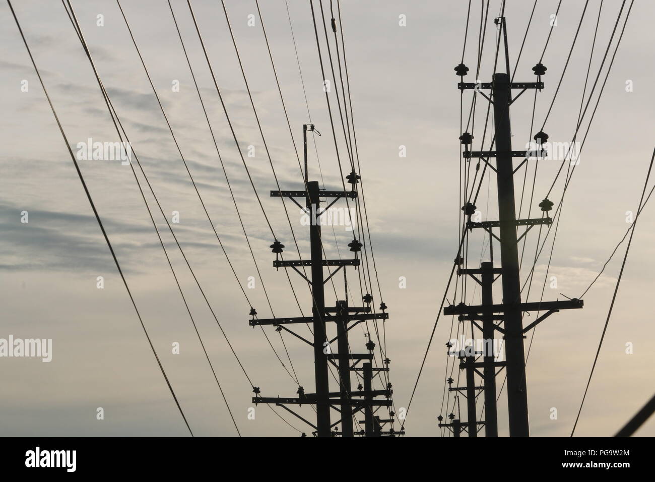 Electrical power lines hang from transmission pylons in Dhaka Stock ...