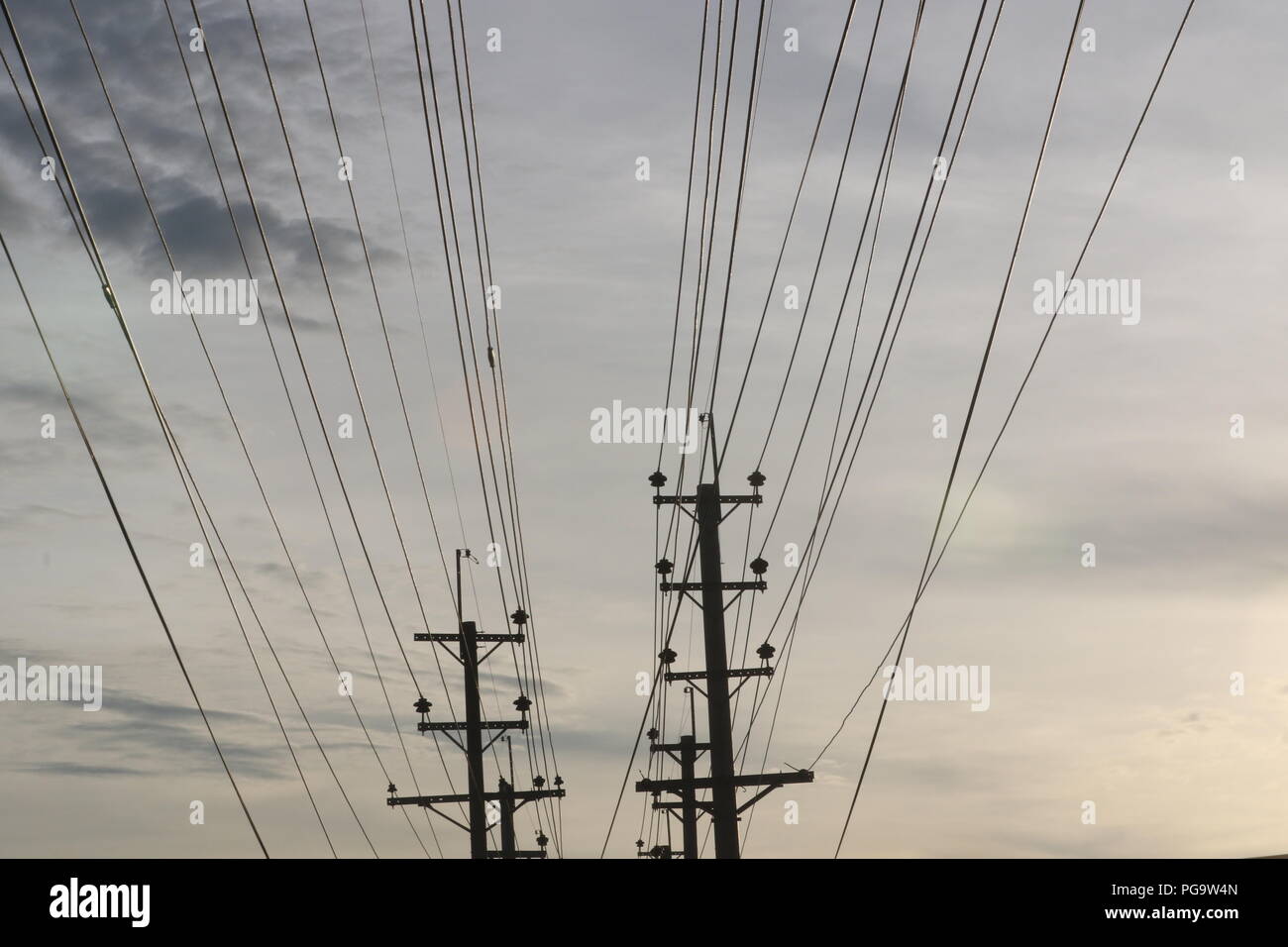 Electrical power lines hang from transmission pylons in Dhaka Stock ...