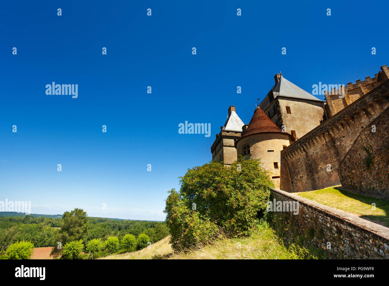 Medieval Biron castle against blue sky, France Stock Photo - Alamy
