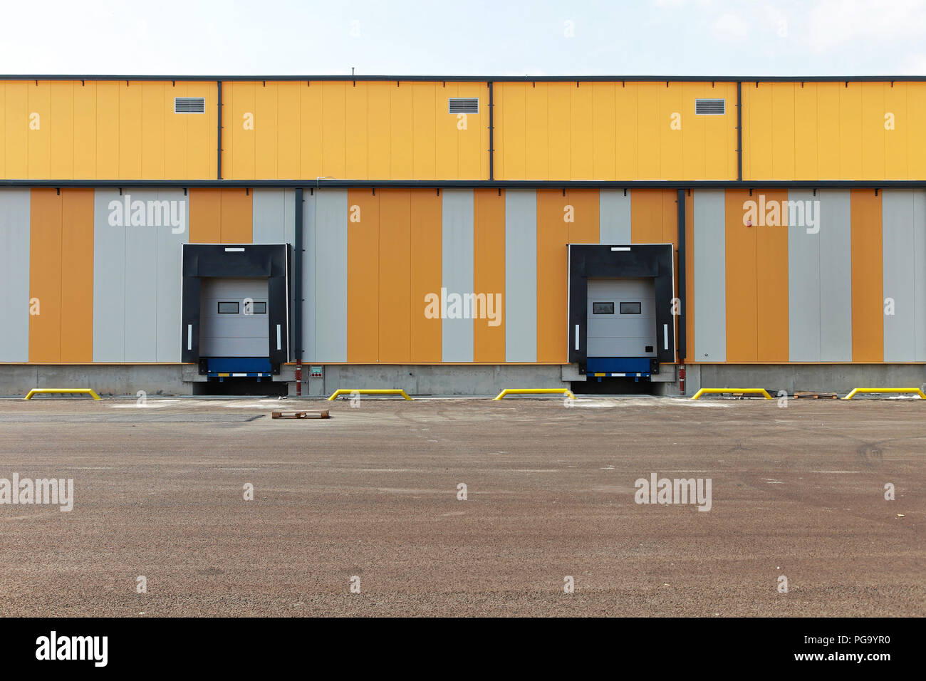 Two ramps for loading trucks at warehouse Stock Photo - Alamy