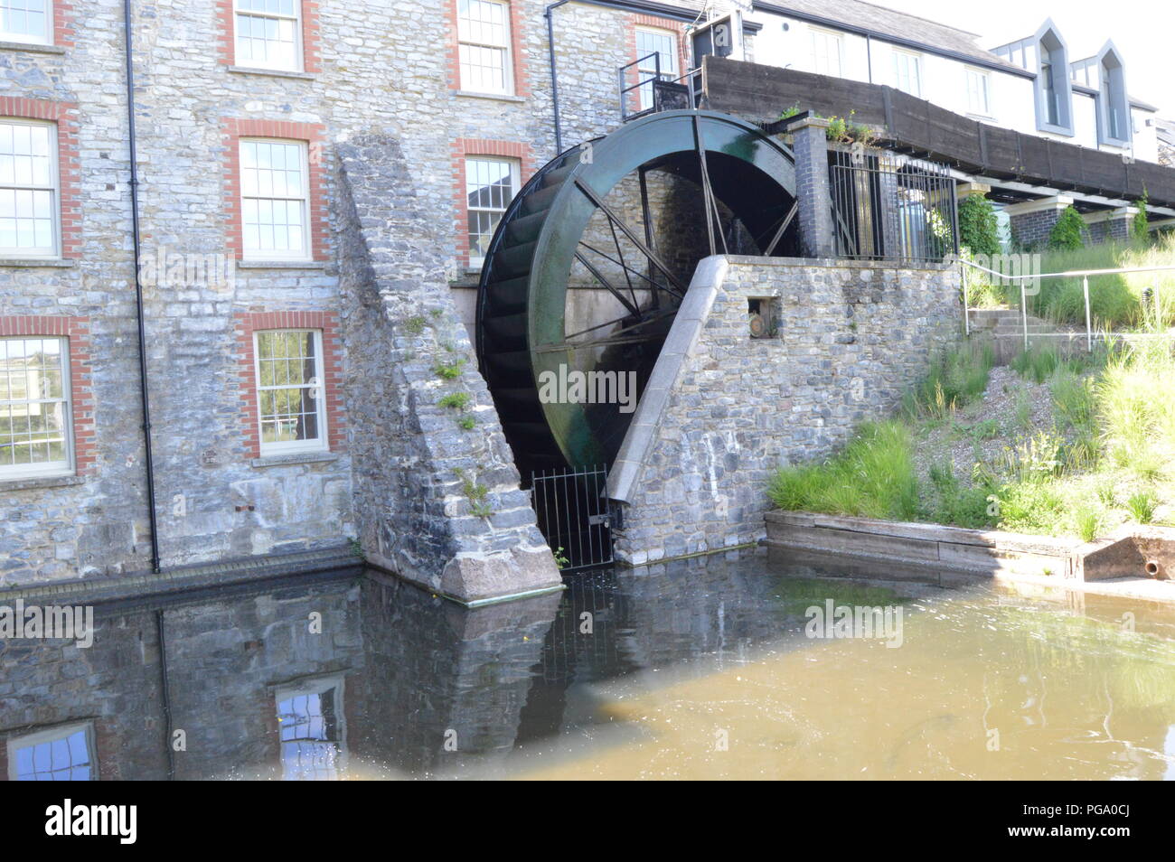 Working water wheel at Buckfast Abbey, Deven England Stock Photo - Alamy