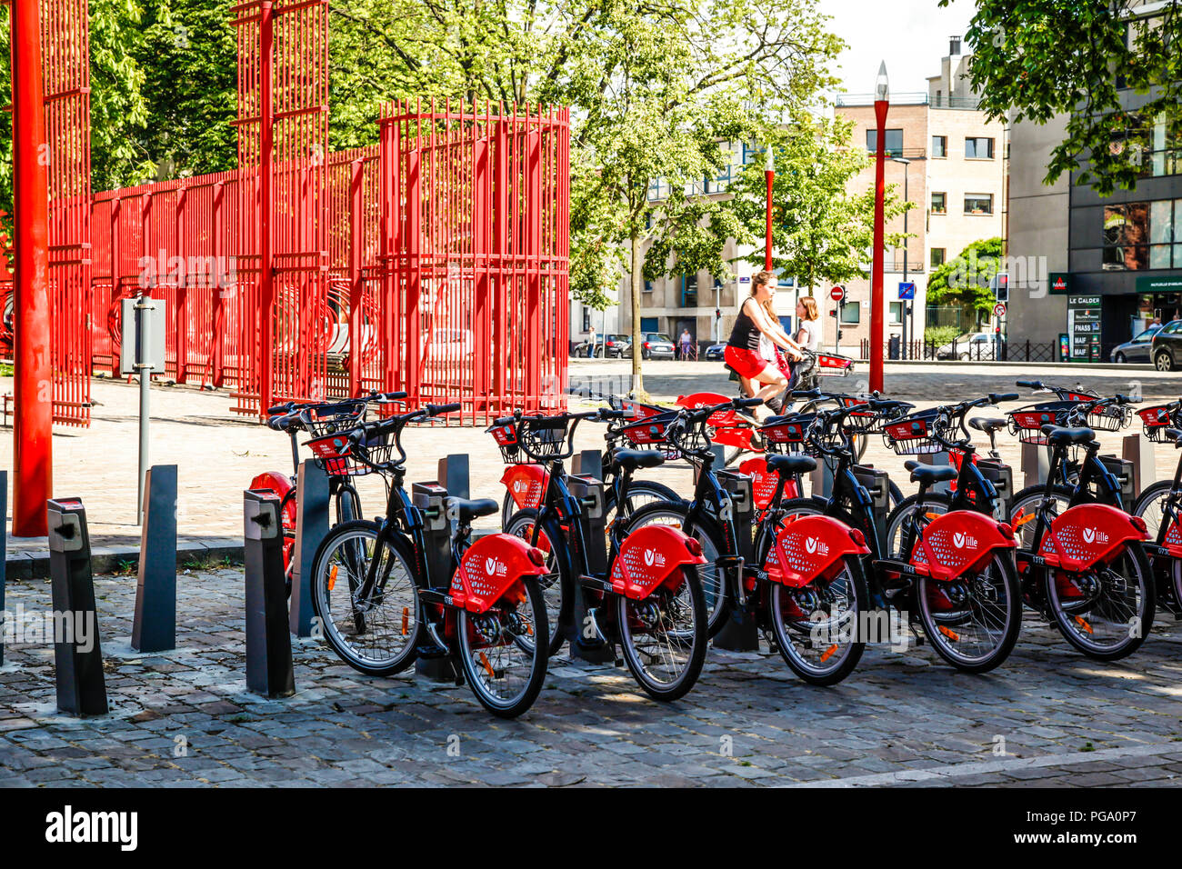 Red and black tourist rent-a-bikes, near Park Jean-Baptiste Lebas in ...