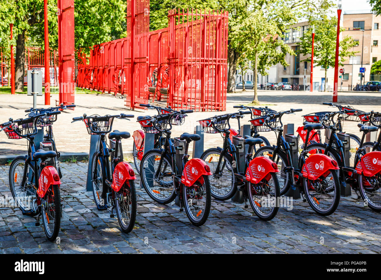 Red and black tourist rent-a-bikes, near Park Jean-Baptiste Lebas in ...