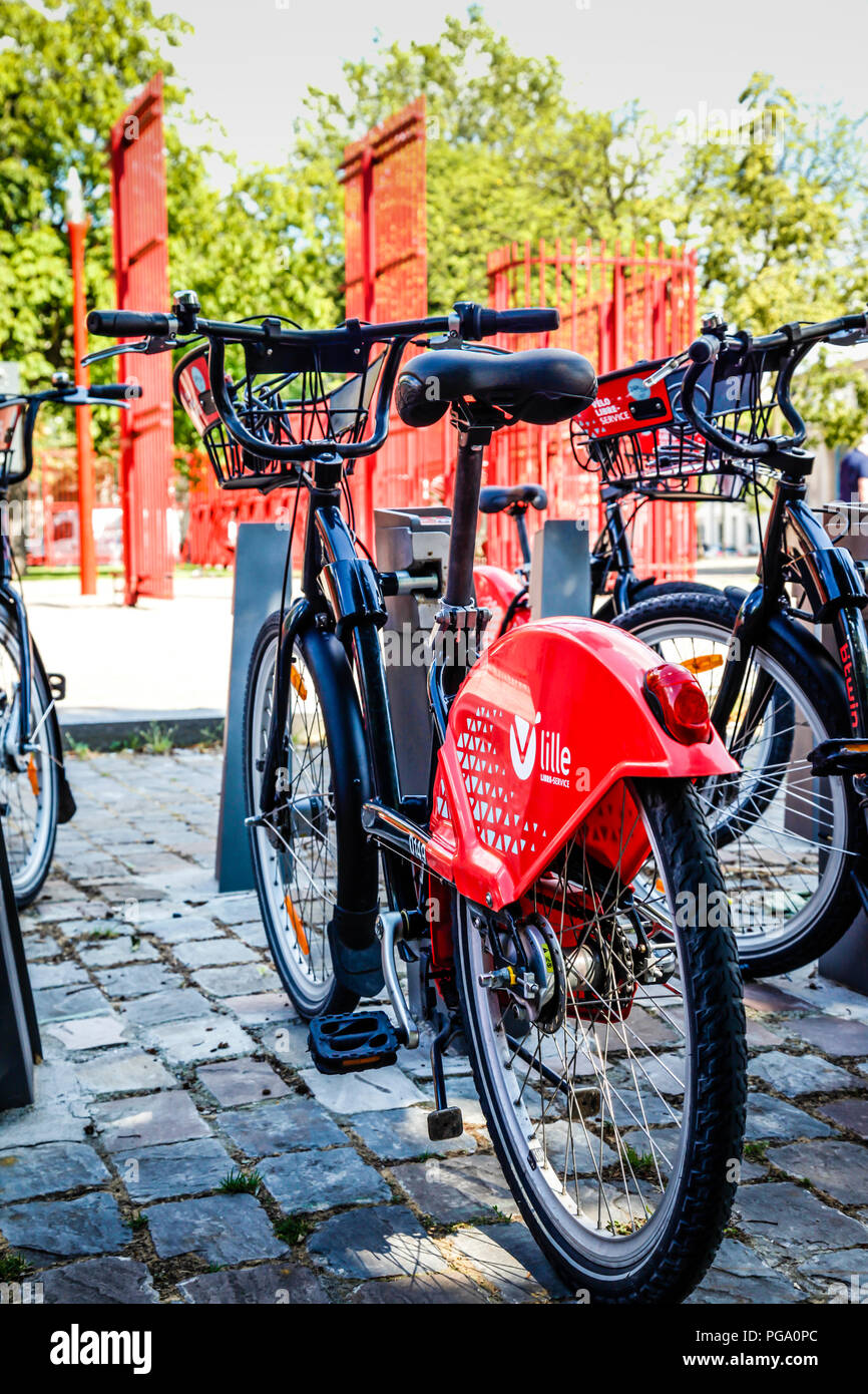 Red and black tourist rent-a-bikes, near Park Jean-Baptiste Lebas in ...