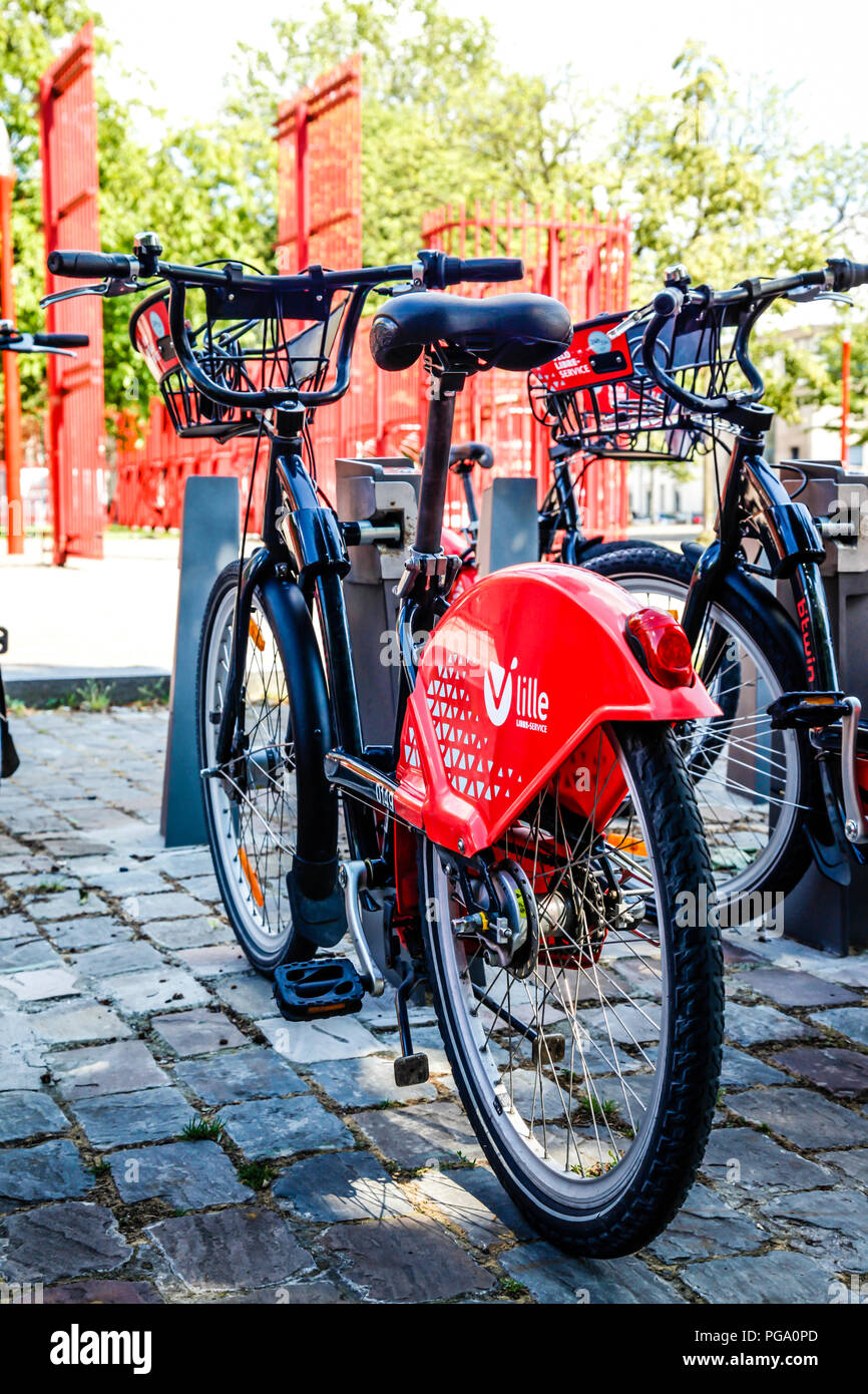 Red and black tourist rent-a-bikes, near Park Jean-Baptiste Lebas in ...
