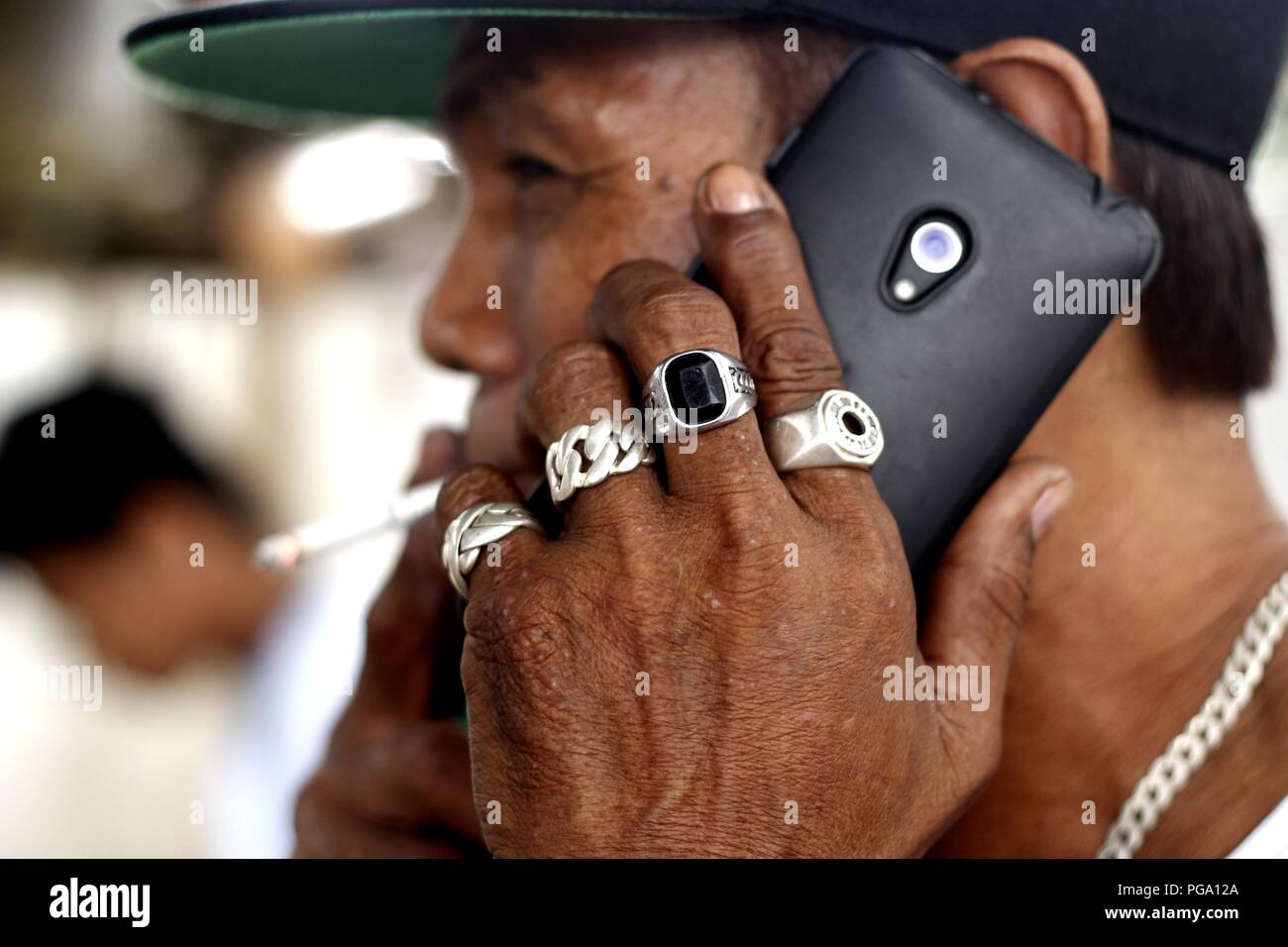 Filipino man on the phone hi-res stock photography and images - Alamy