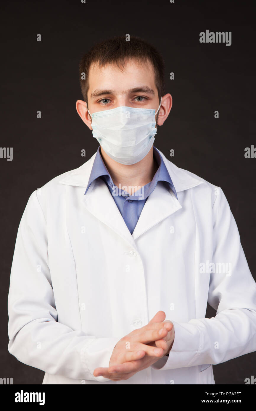 Doctor in a mask hi-res stock photography and images - Alamy