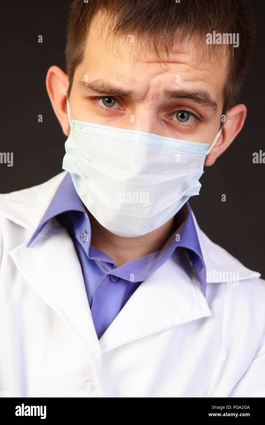 Doctor in a mask hi-res stock photography and images - Alamy