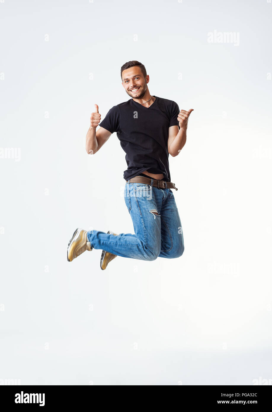 Happy excited man jumping. carefree and fun concept Stock Photo - Alamy