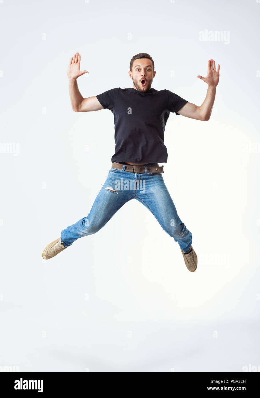 Happy excited man jumping. carefree and fun concept Stock Photo - Alamy