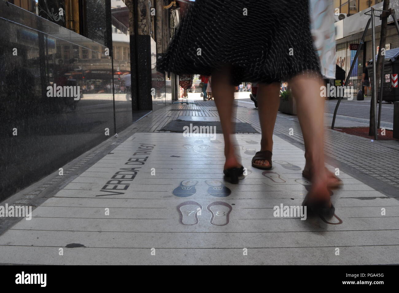 Buenos Aires/Argentina: tourist girls practicing tango steps at the ...