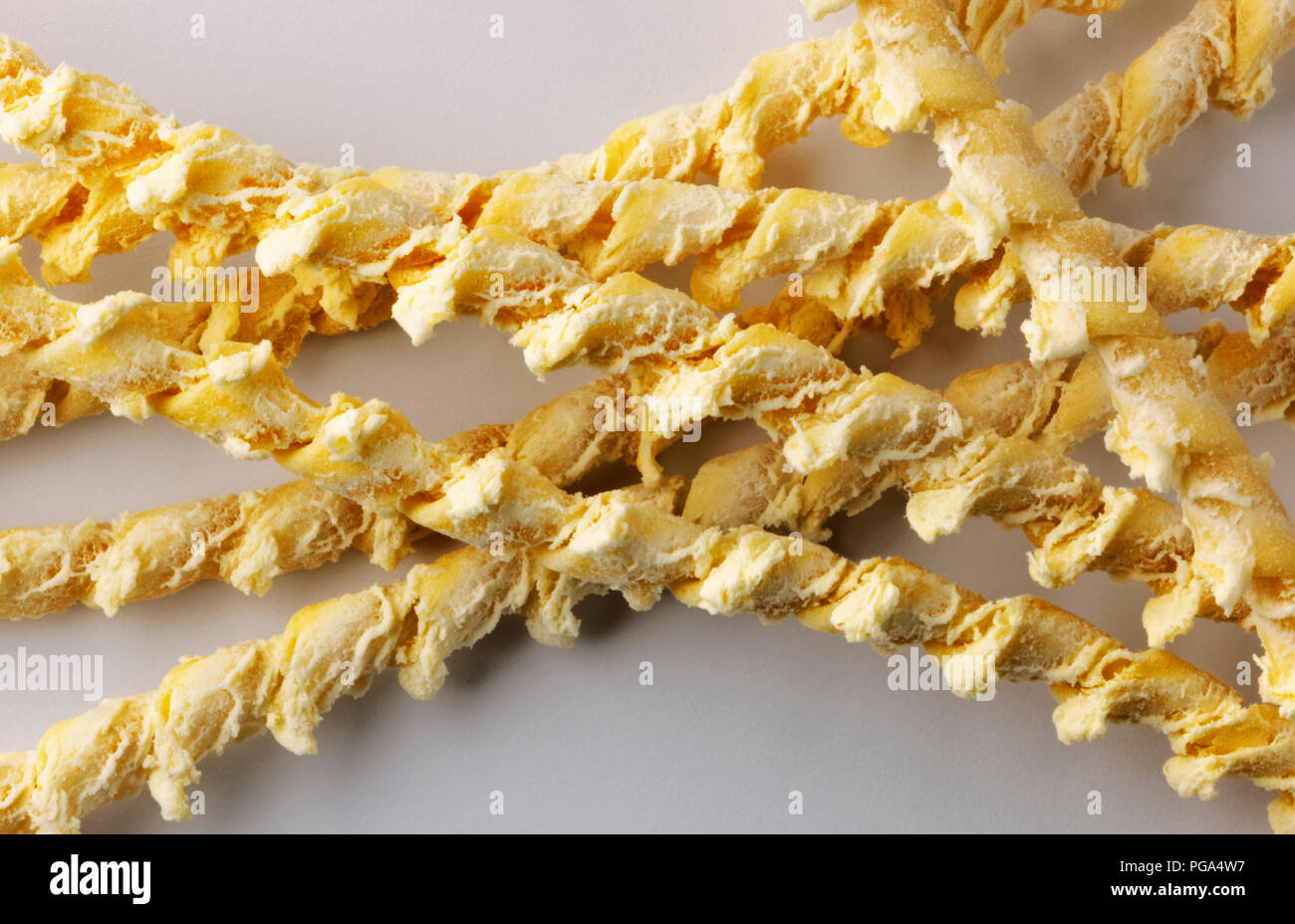 Sicilian pasta busiate , twisting strands of pasta on a white ...