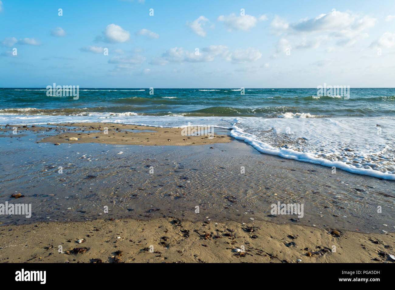 sea water on the beach under a cloudy sky of summer Stock Photo - Alamy