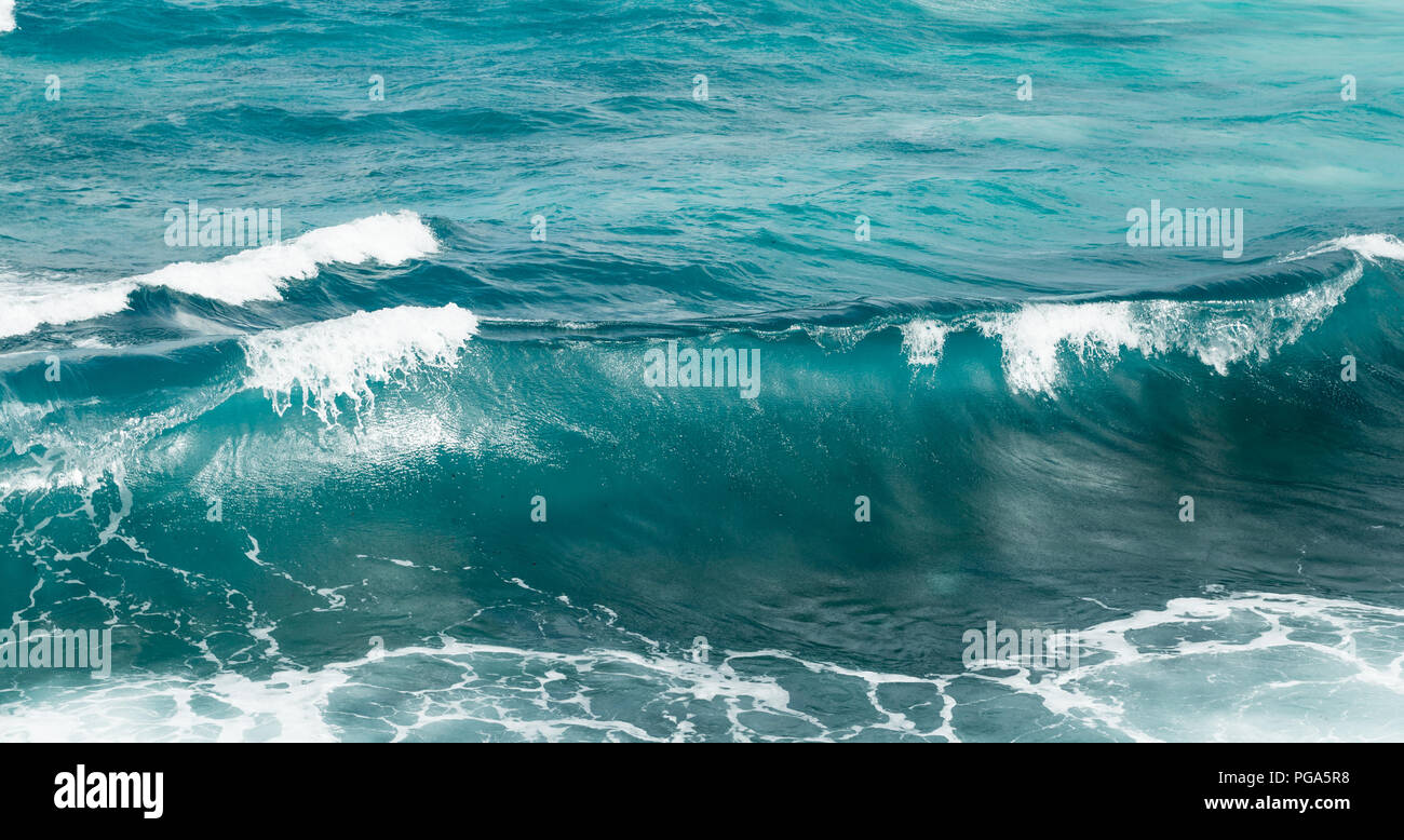 Refreshing blue ocean wave at the Seychelles Stock Photo - Alamy