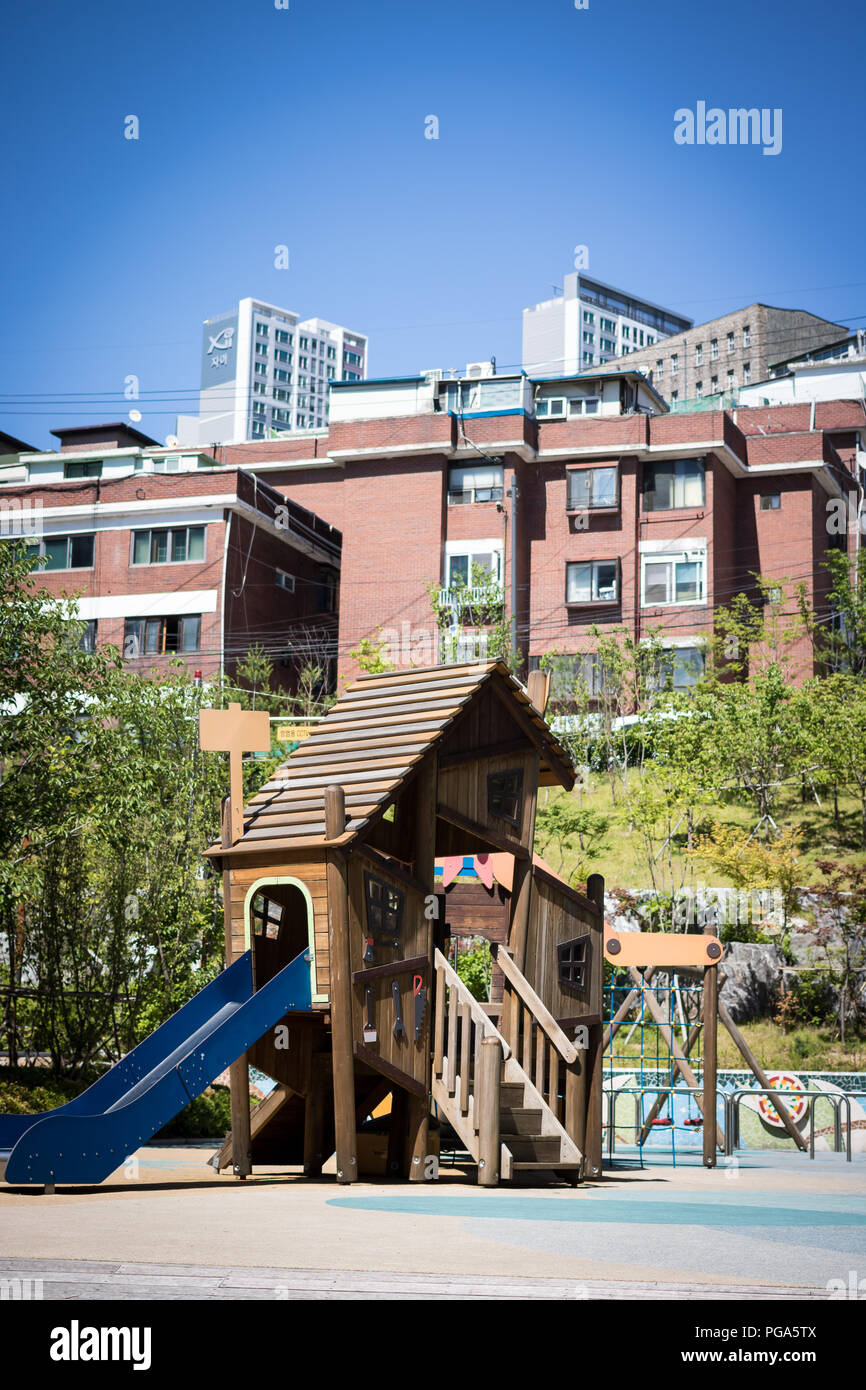 Playground with Peterpan's house in front of villas and apartment in ...