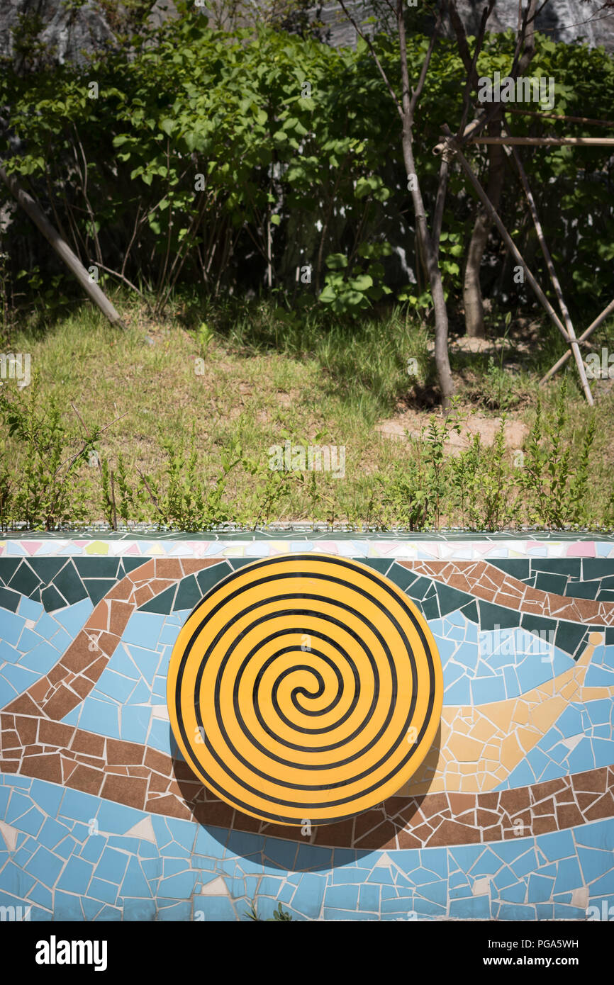 Funny rotating wheel makes illusion in the playground in Korea Stock ...