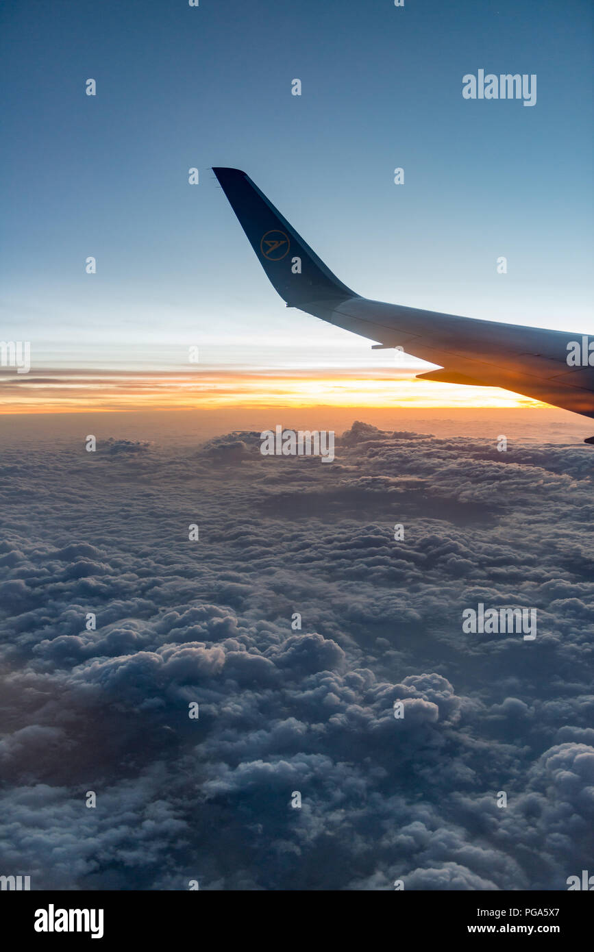 View from the plane at sunset Stock Photo - Alamy