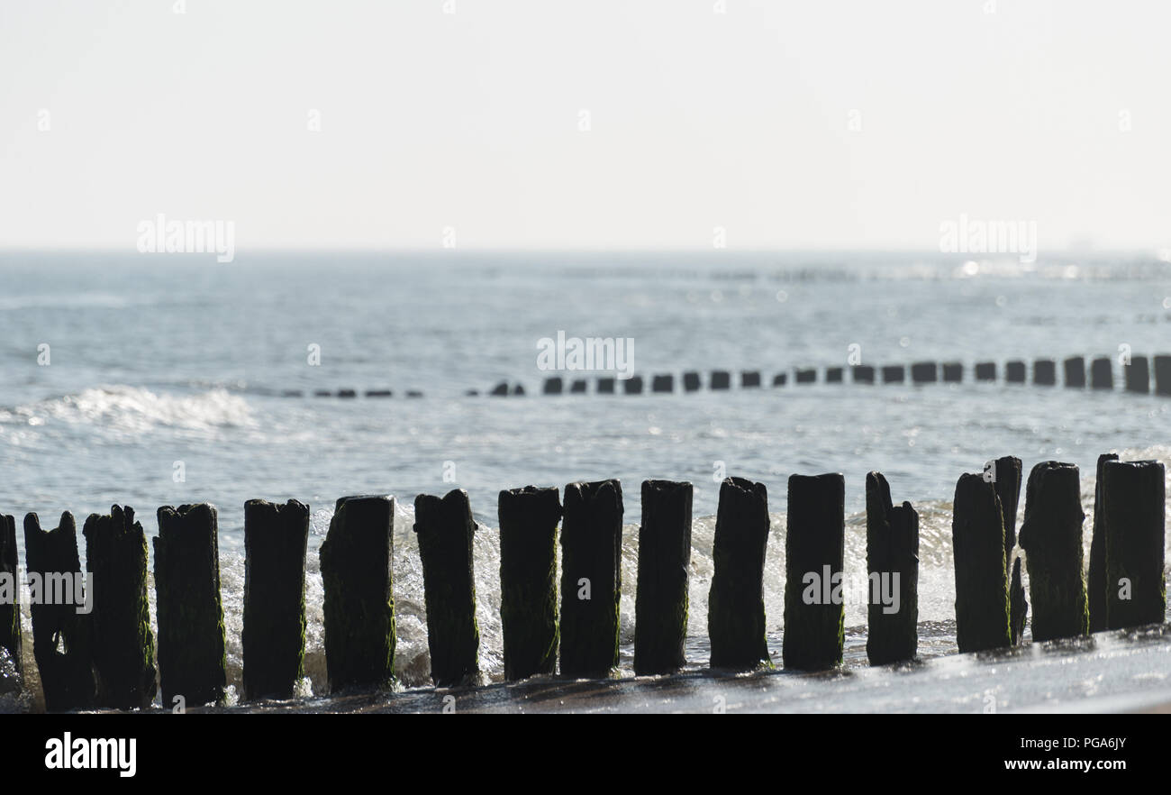 Wooden Sea Defense Poles On Stock Photos & Wooden Sea Defense Poles On ...