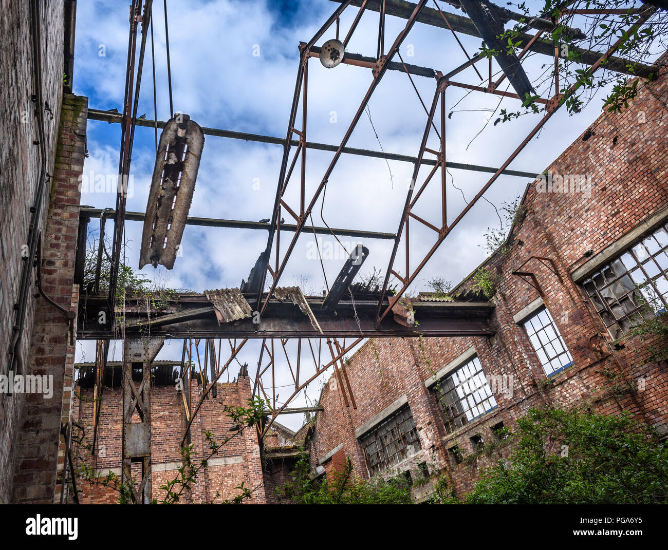 Old industrial brick warehouse with exposed roof girders Stock Photo ...