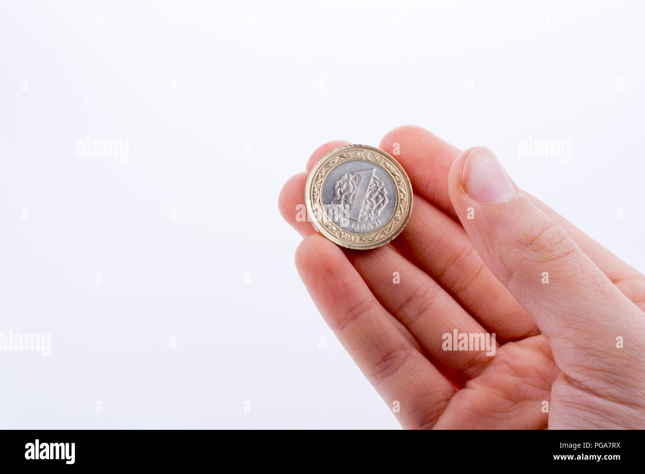 Turkish coin one Turkish Lira in hand Stock Photo - Alamy
