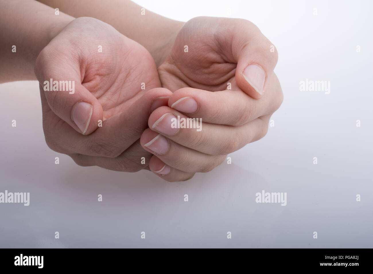 Hand holding on a white background Stock Photo - Alamy