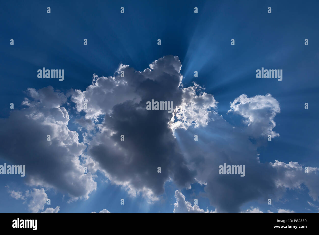 Sun rays behind a rain cloud (Nimbostratus), Germany Stock Photo - Alamy
