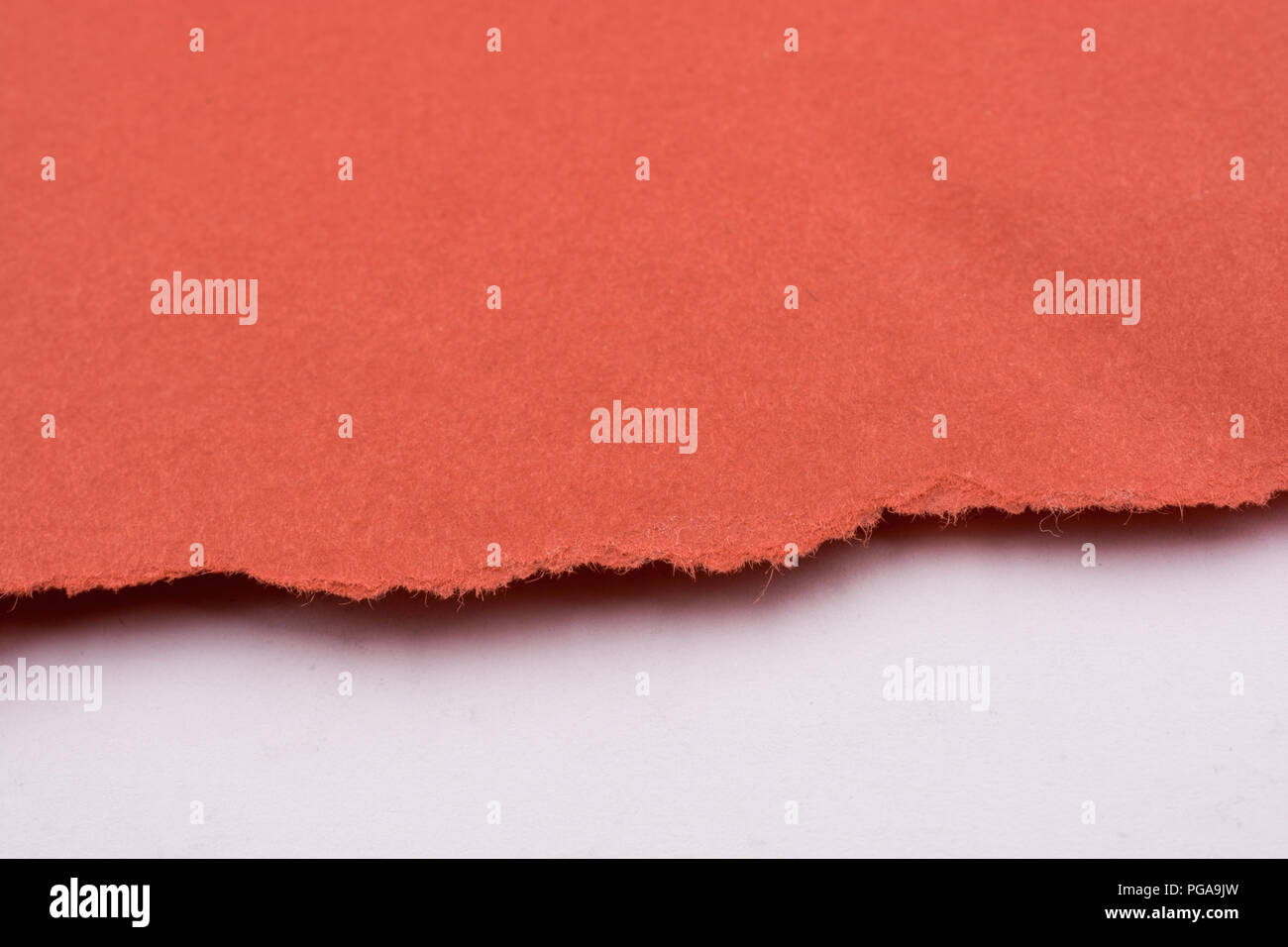 Torn sheet of paper on a background Stock Photo - Alamy
