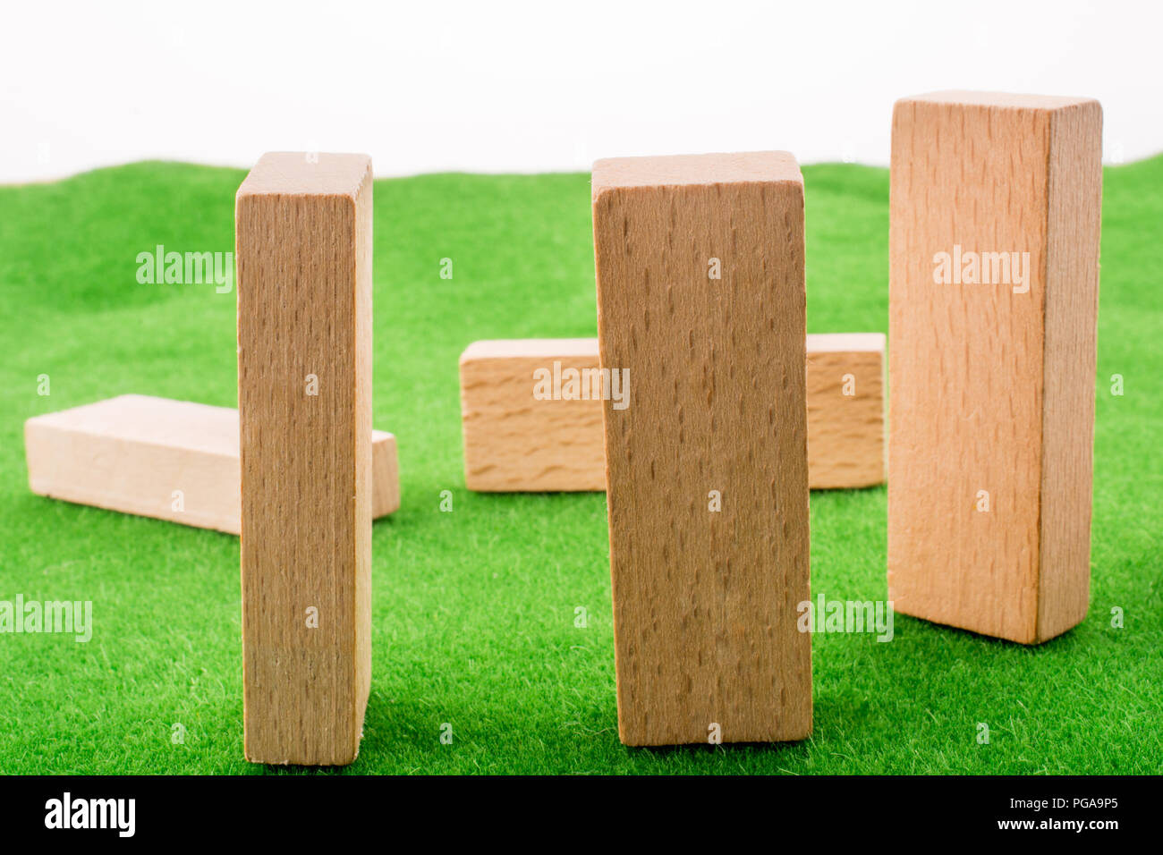 Wooden dominos on green grass Stock Photo - Alamy