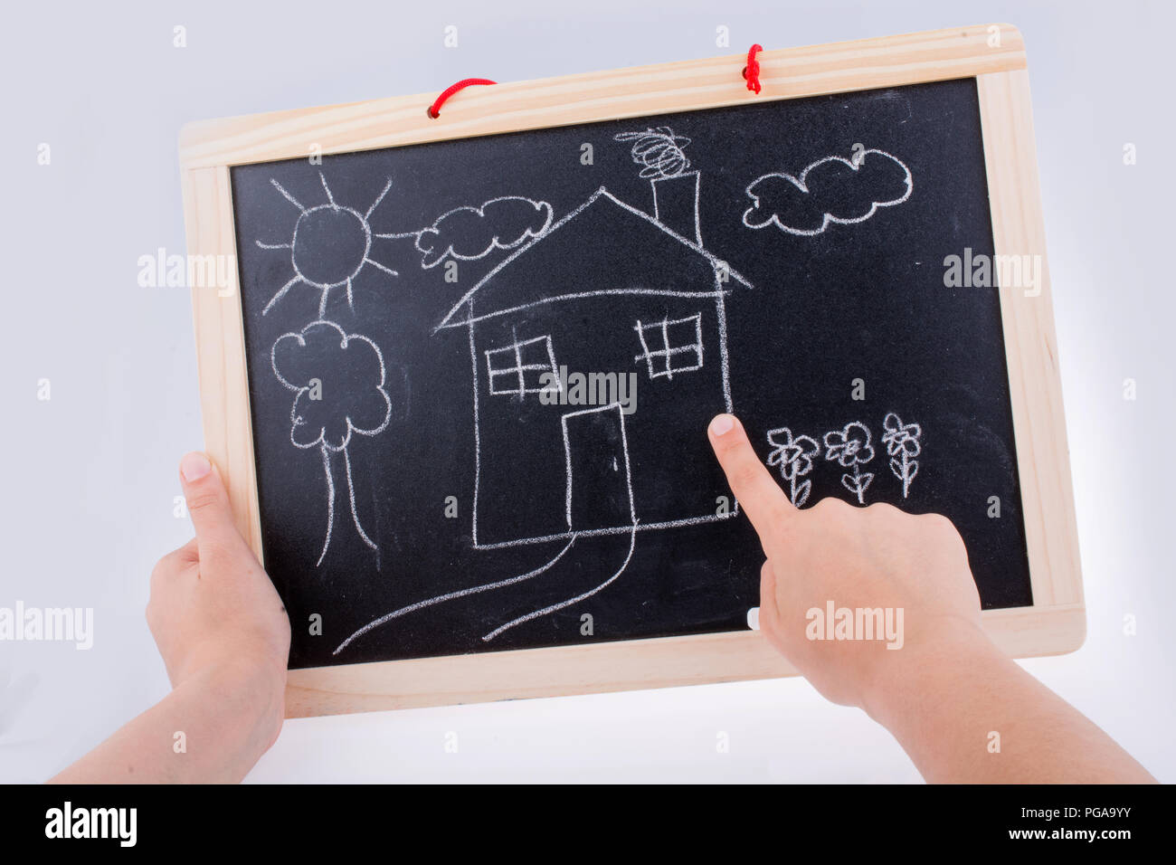Hand drawing a house on the blackboard with a chalk Stock Photo - Alamy