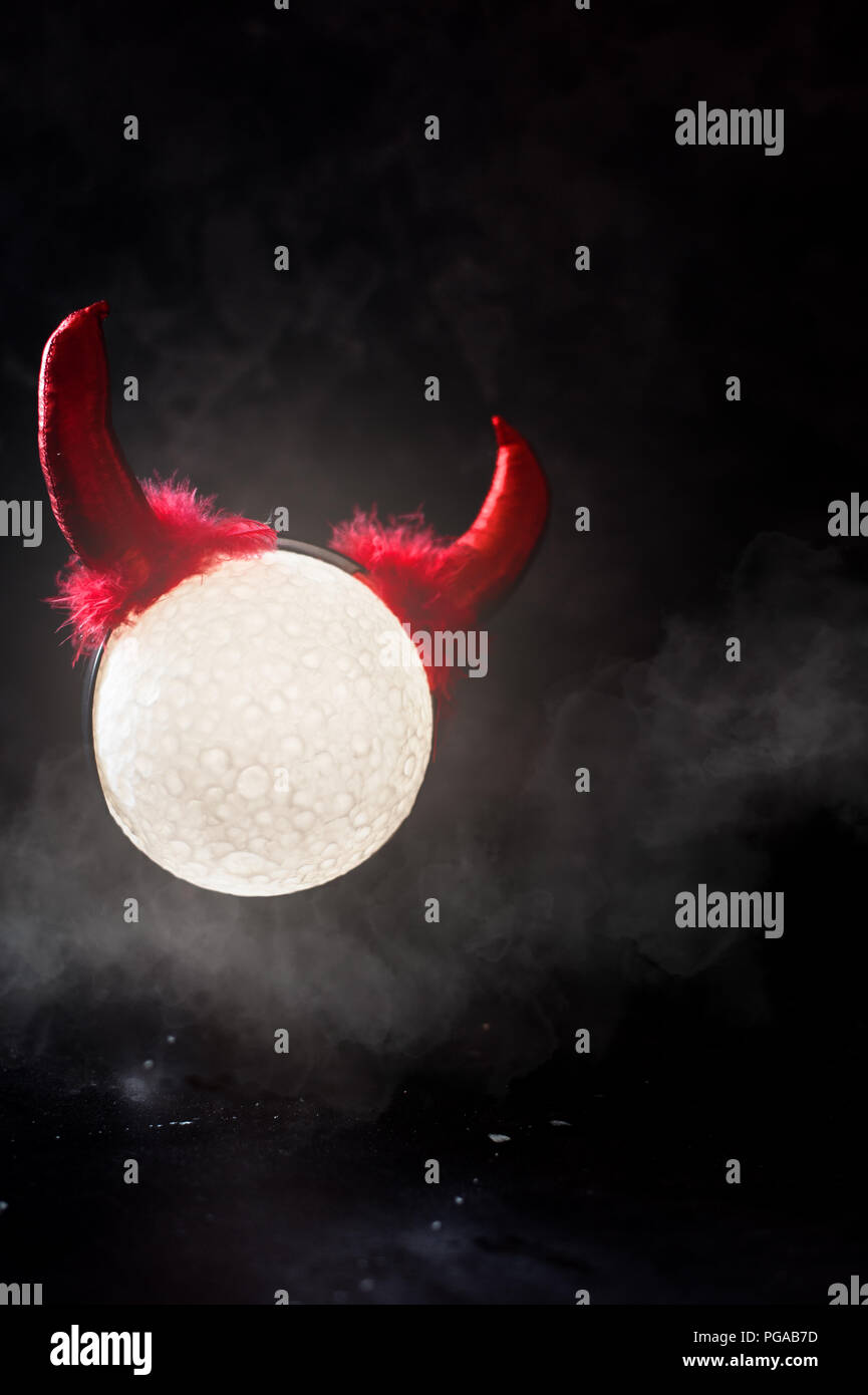 Halloween background moon devil horns on dark Stock Photo - Alamy