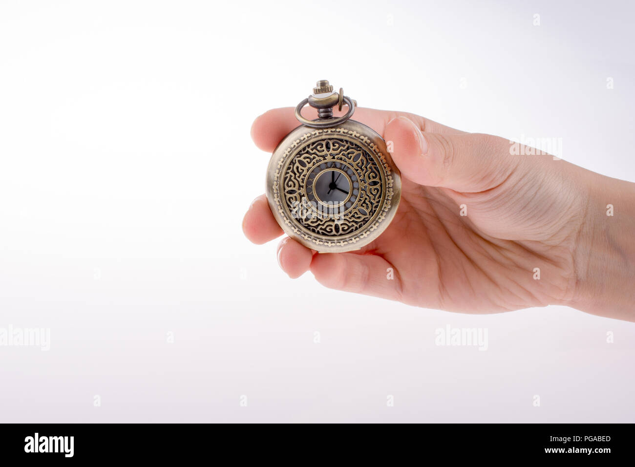 Hand holding a retro styled pocket watch in hand Stock Photo - Alamy