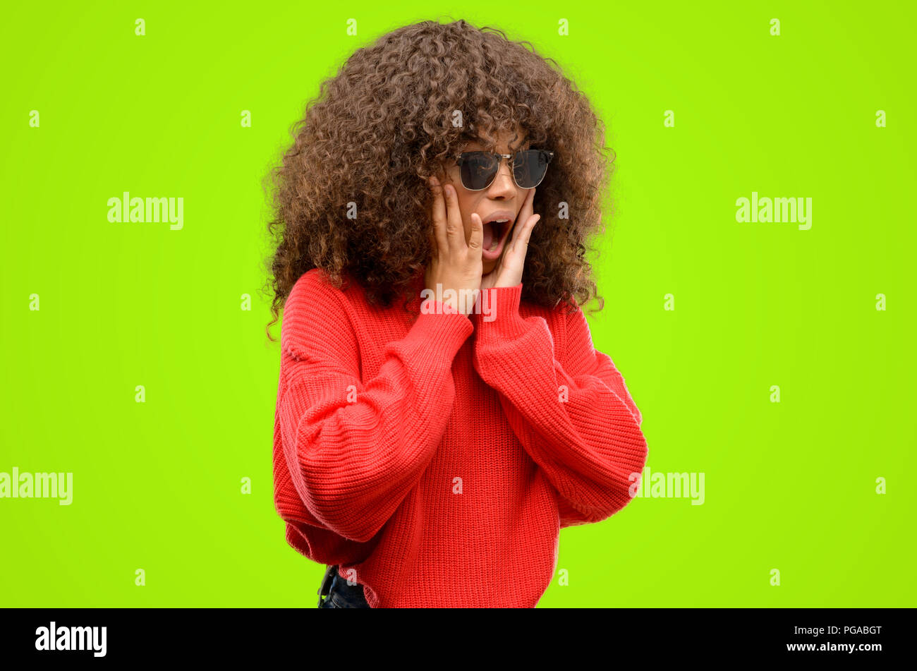 African american woman wearing sunglasses stressful keeping hands on ...