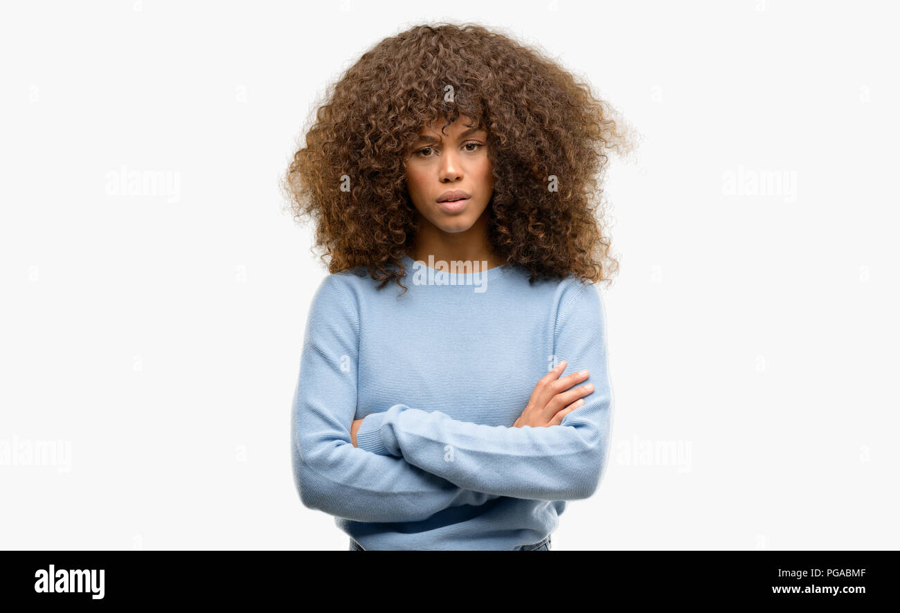 African american woman wearing a sweater skeptic and nervous ...