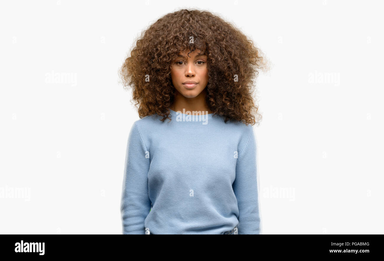 African american woman wearing a sweater with serious expression on ...