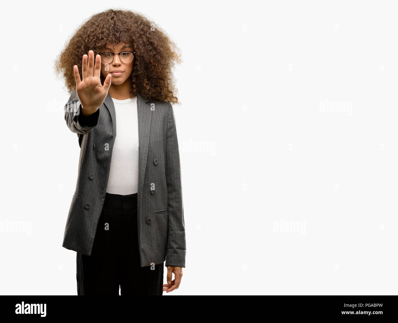 African american business woman wearing glasses doing stop sing with ...