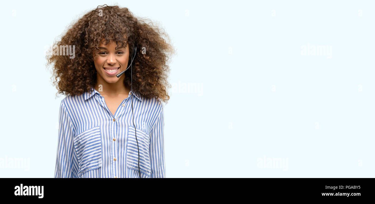 African american call center operator woman with a happy face standing ...