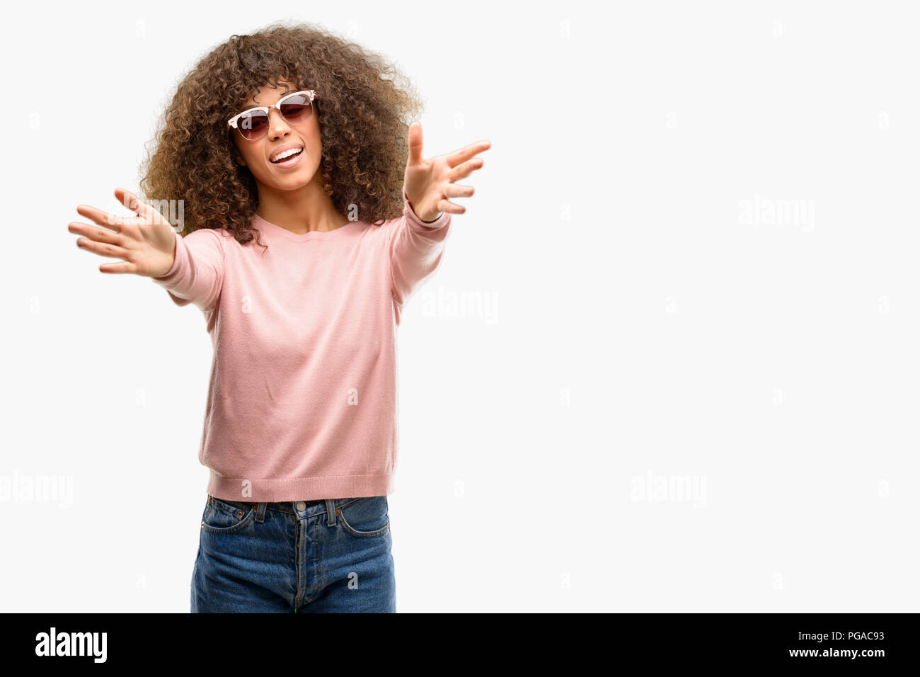 African american woman wearing pink sunglasses looking at the camera ...
