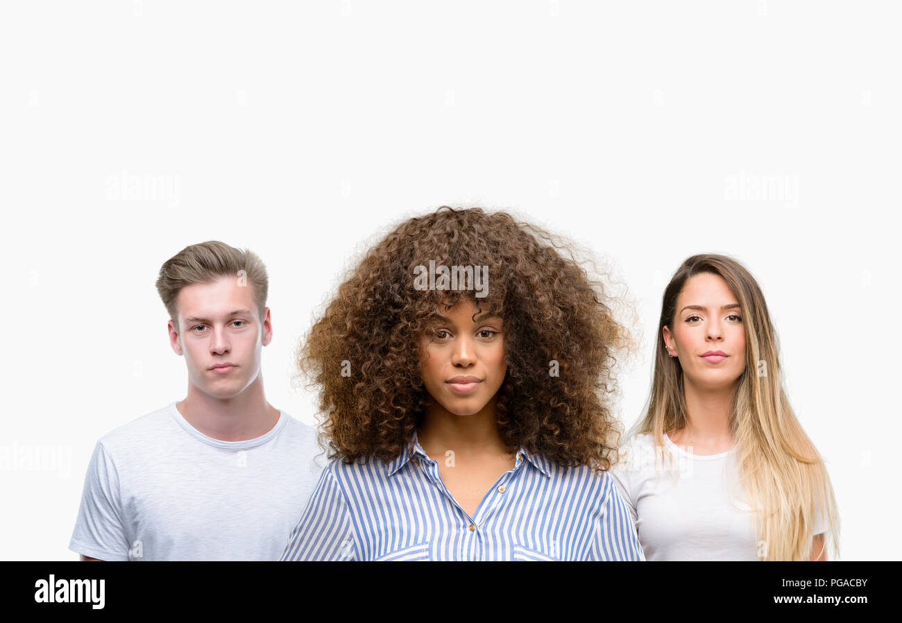 Group of young people over white background with a confident expression ...