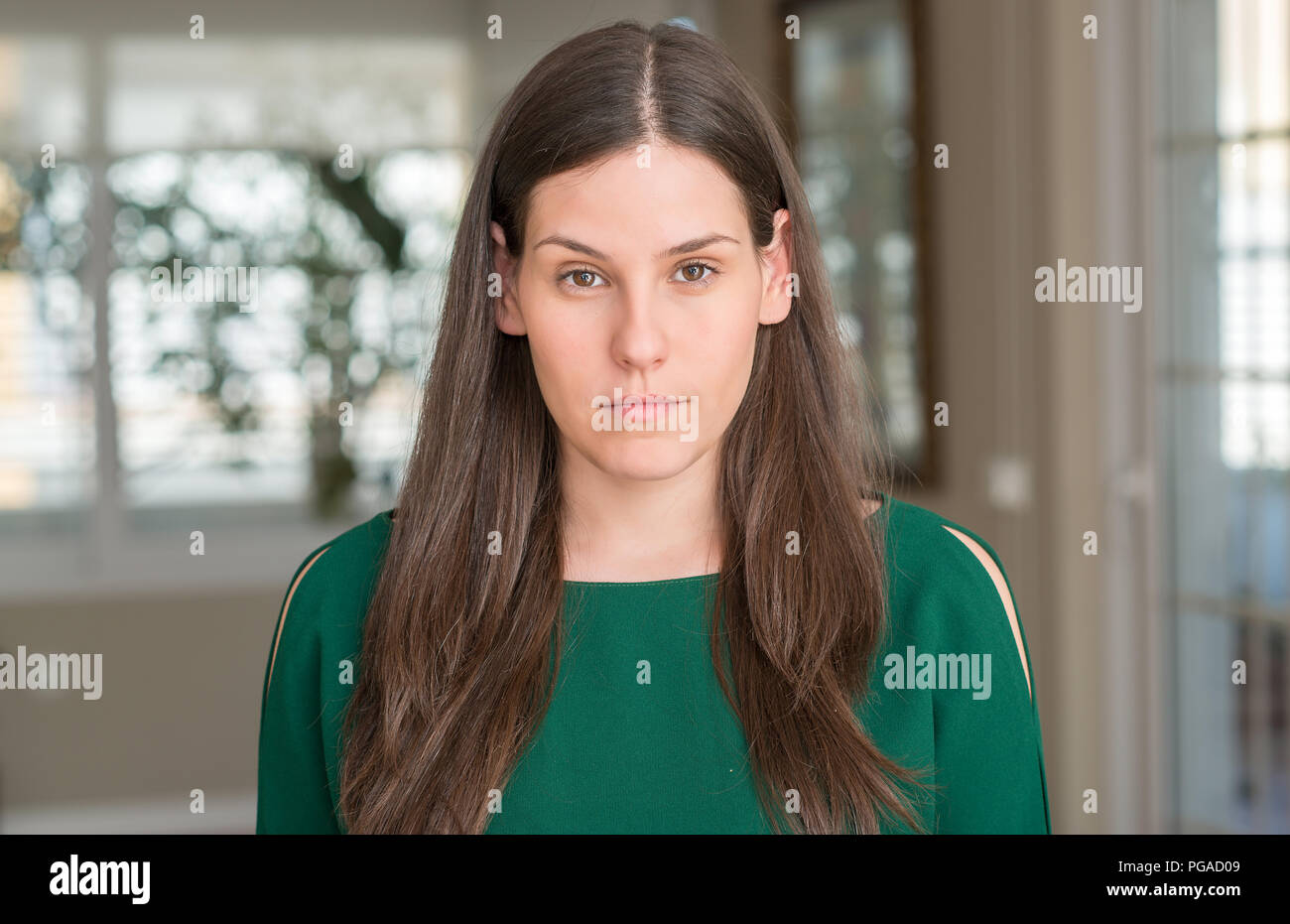 Young beautiful woman at home with a confident expression on smart face ...