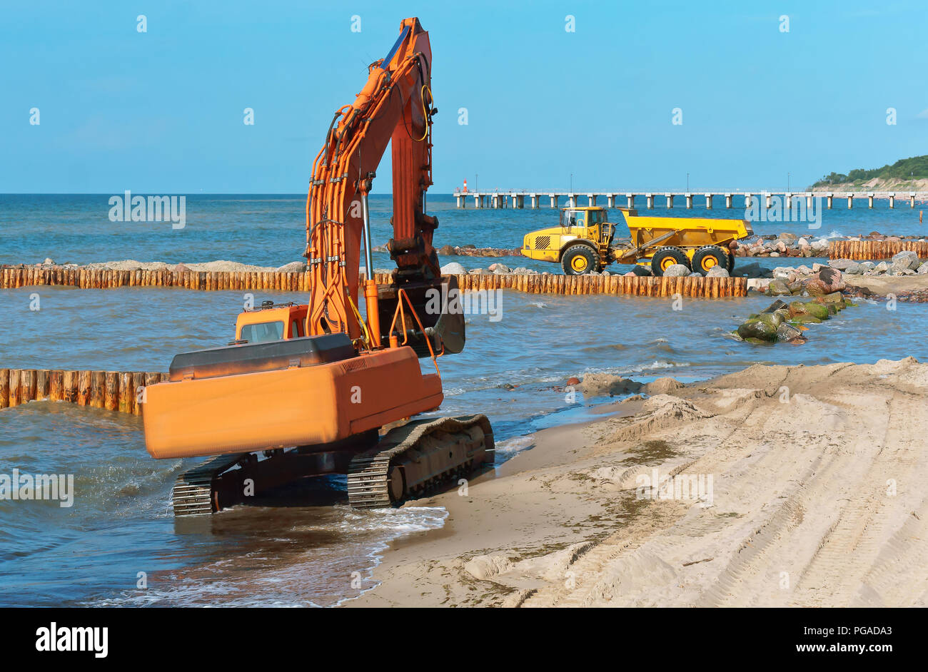 construction equipment on the shore, the construction of breakwaters ...